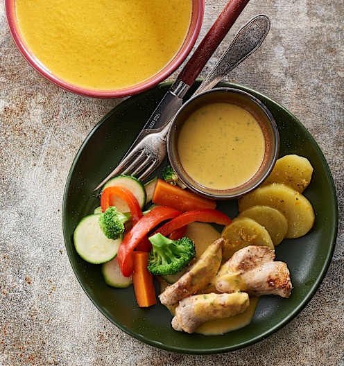 Menu with vegetable velouté, chicken with mustard sauce and steamed ...