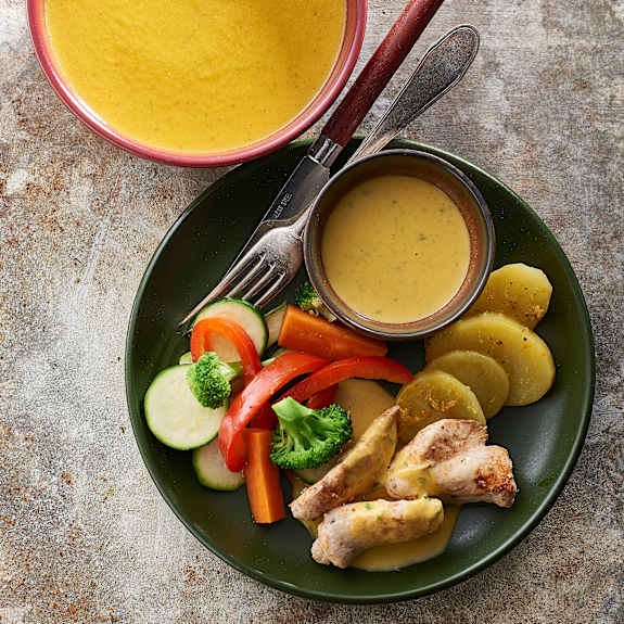 Menu with vegetable velouté, chicken with mustard sauce and steamed ...