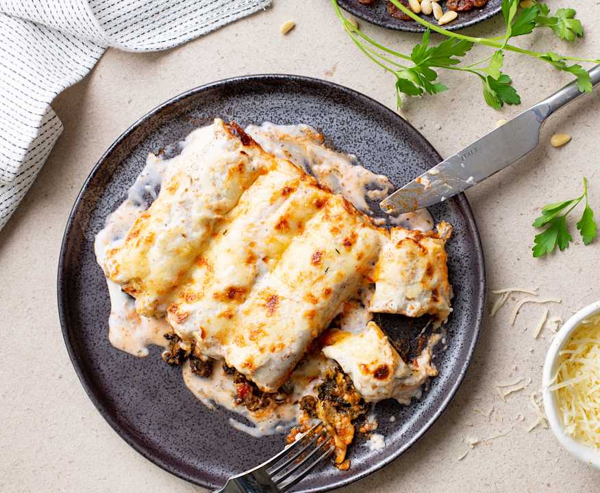 Canelones de espinacas con piñones y pasas - Cookidoo® – the official ...